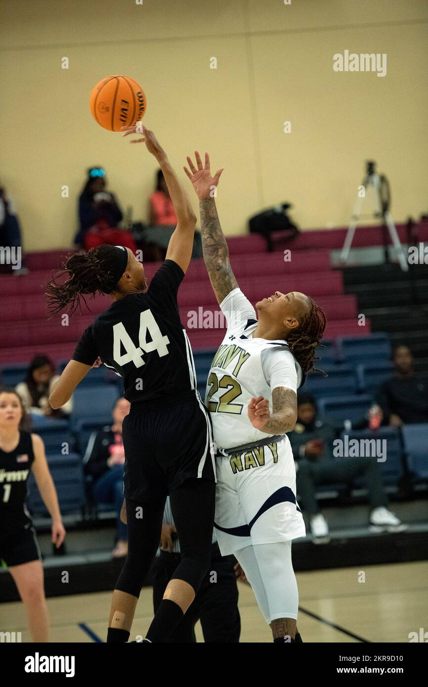 Navy Petty Officer 2nd Class Ariel Thomas tips off for Navy during the ...