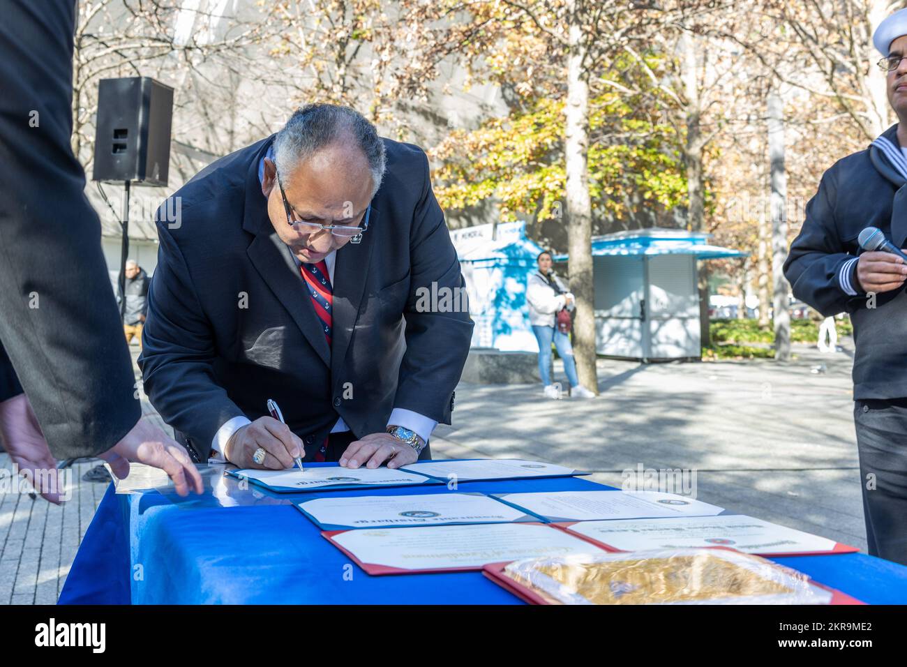 Secretary of the Navy Carlos Del Toro signs certificates before a ...