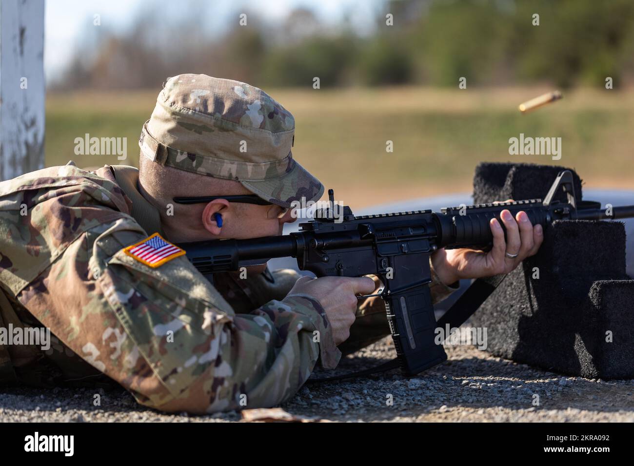 Spc. Robert Buck, with the 130th Engineer Company, shoots his M4 ...