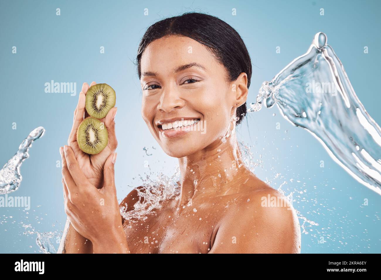 Beauty, water and splash, black woman with kiwi for organic cosmetic ...