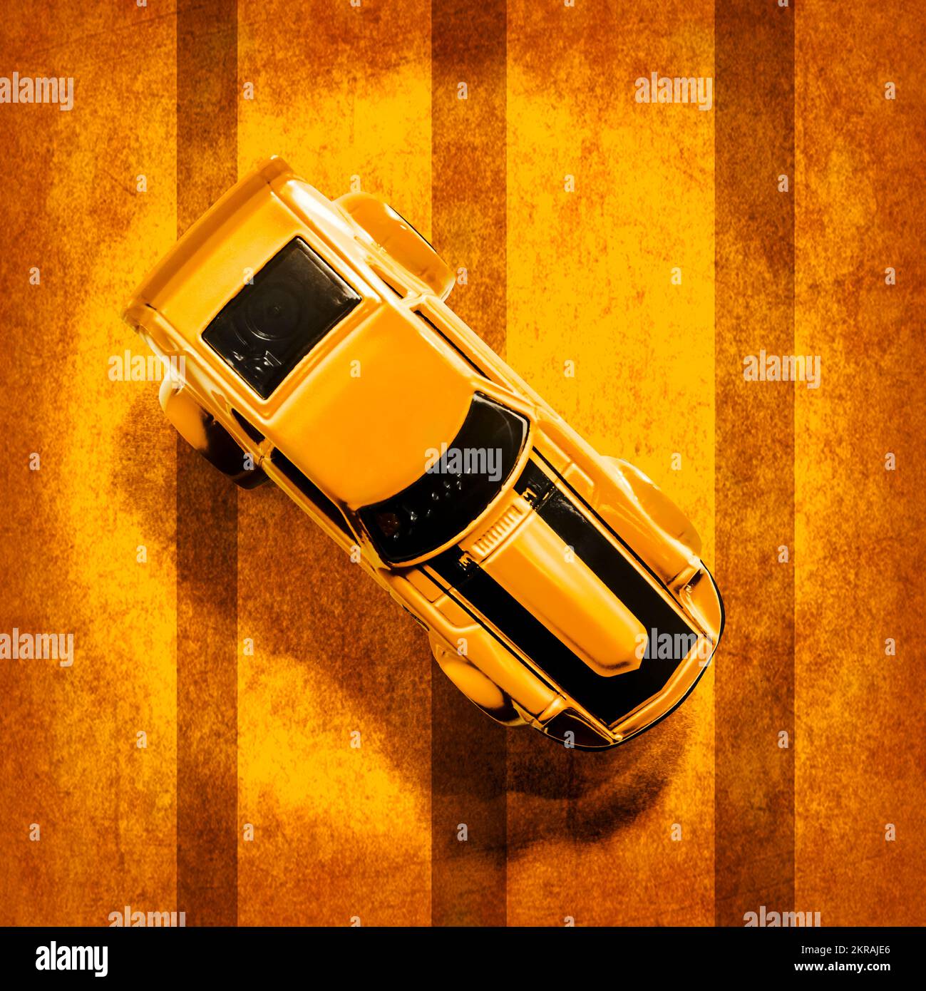 Miniature model racing scene on a small Nissan Fairlady Z on striped ...