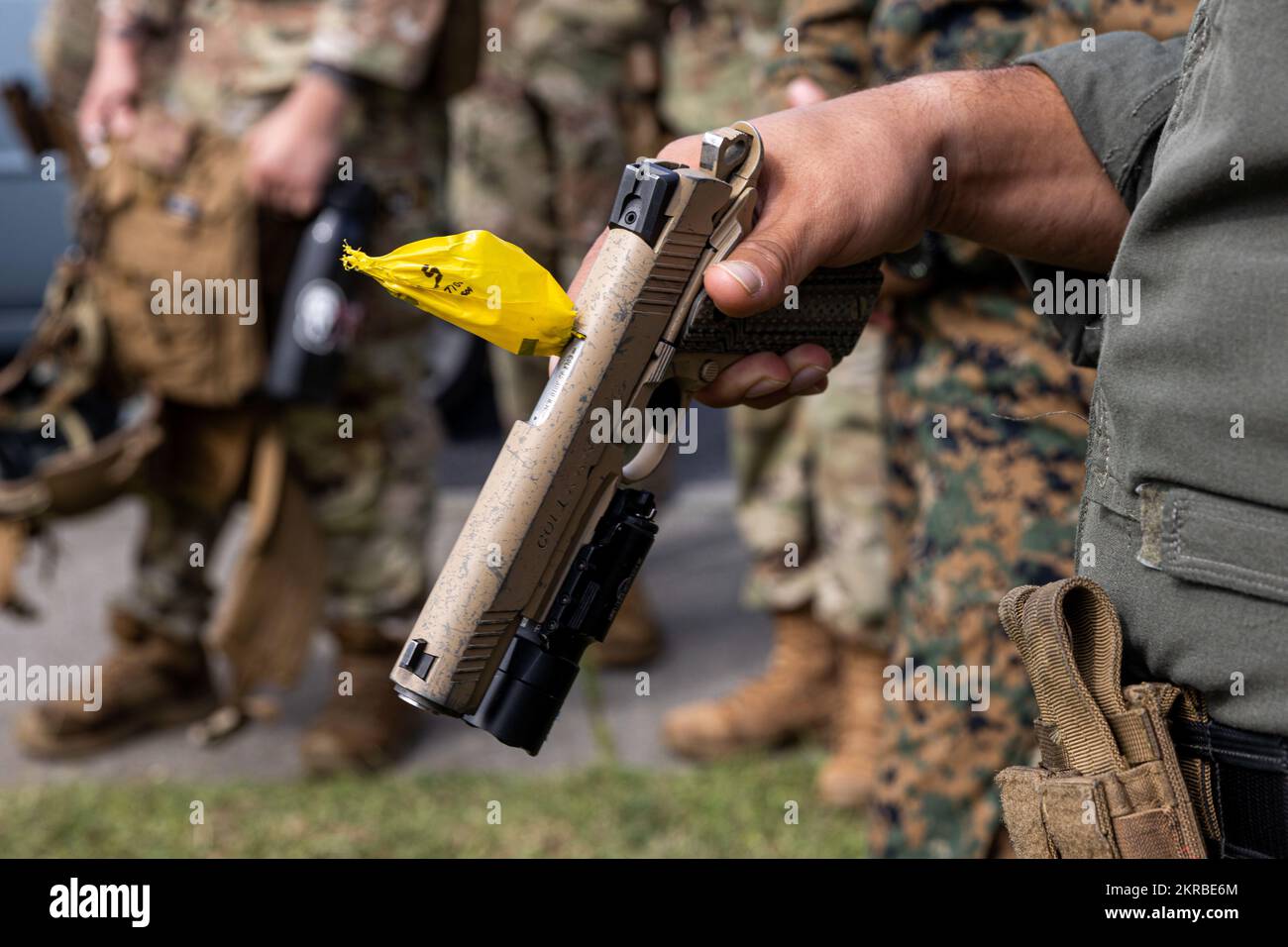 The Colt M45A1 is shown to members of the Japanese Ground Self-Defense ...