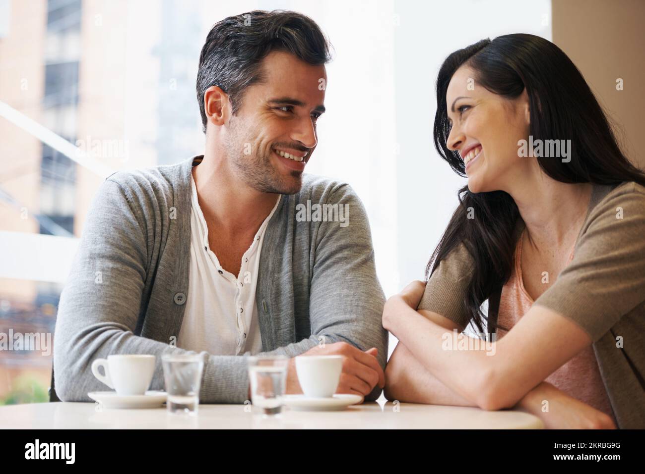 Catching up over some coffee. a young couple grabbing a cup of coffee ...