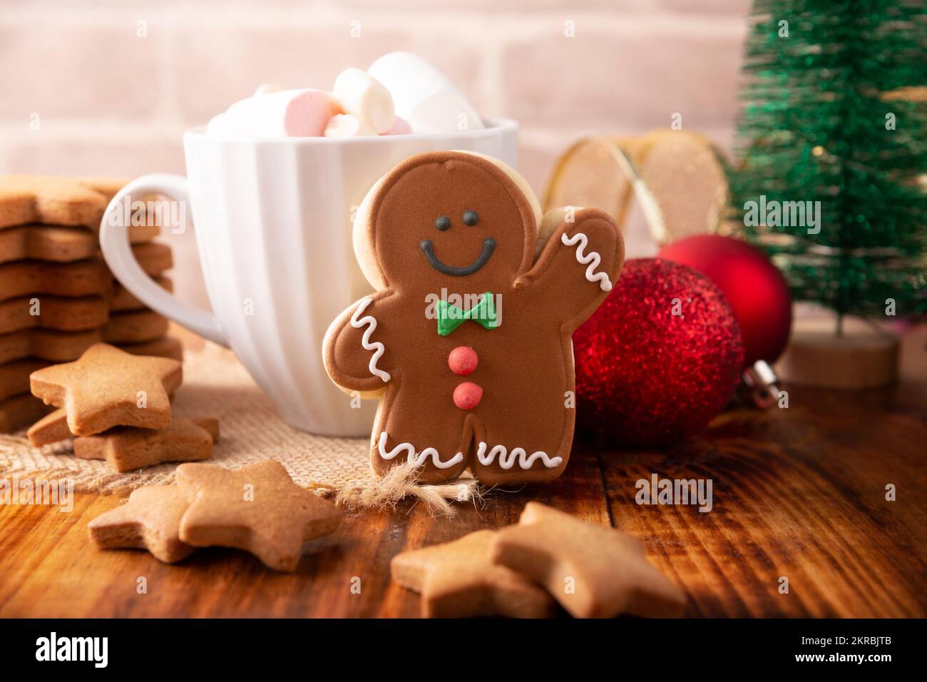 Christmas Homemade gingerbread man cookie and white cup with hot ...