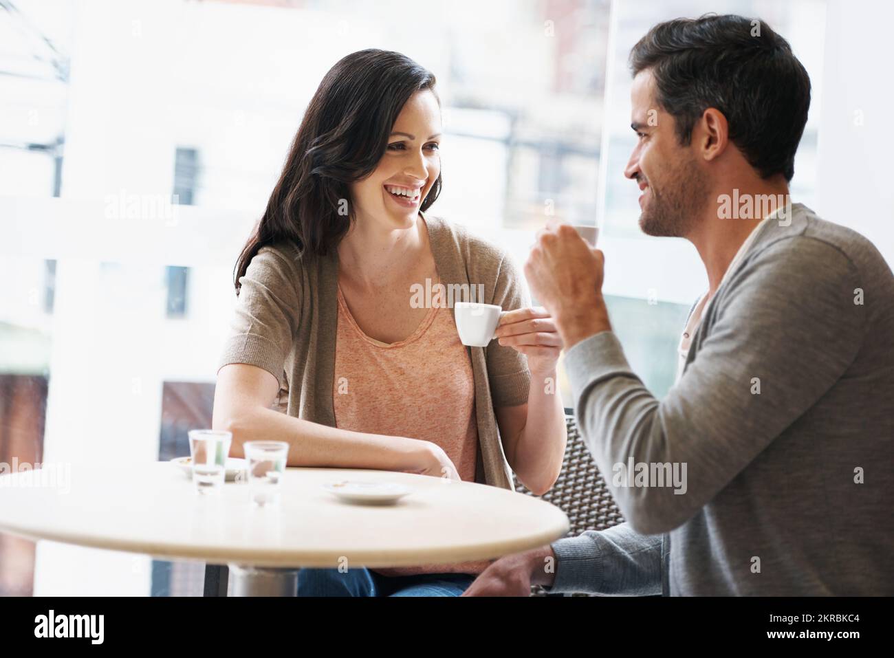 Conversations over some coffee. a young couple grabbing a cup of coffee ...