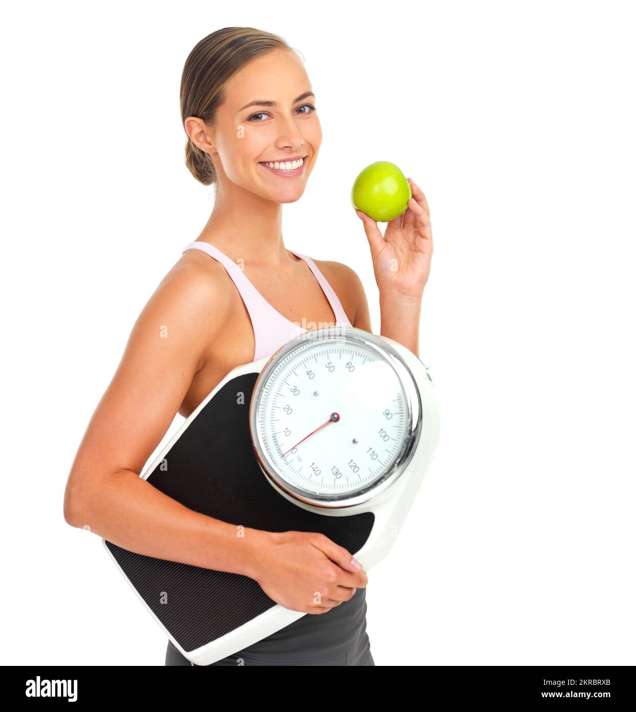 Woman looking really happy about her weight loss, isolated on white ...