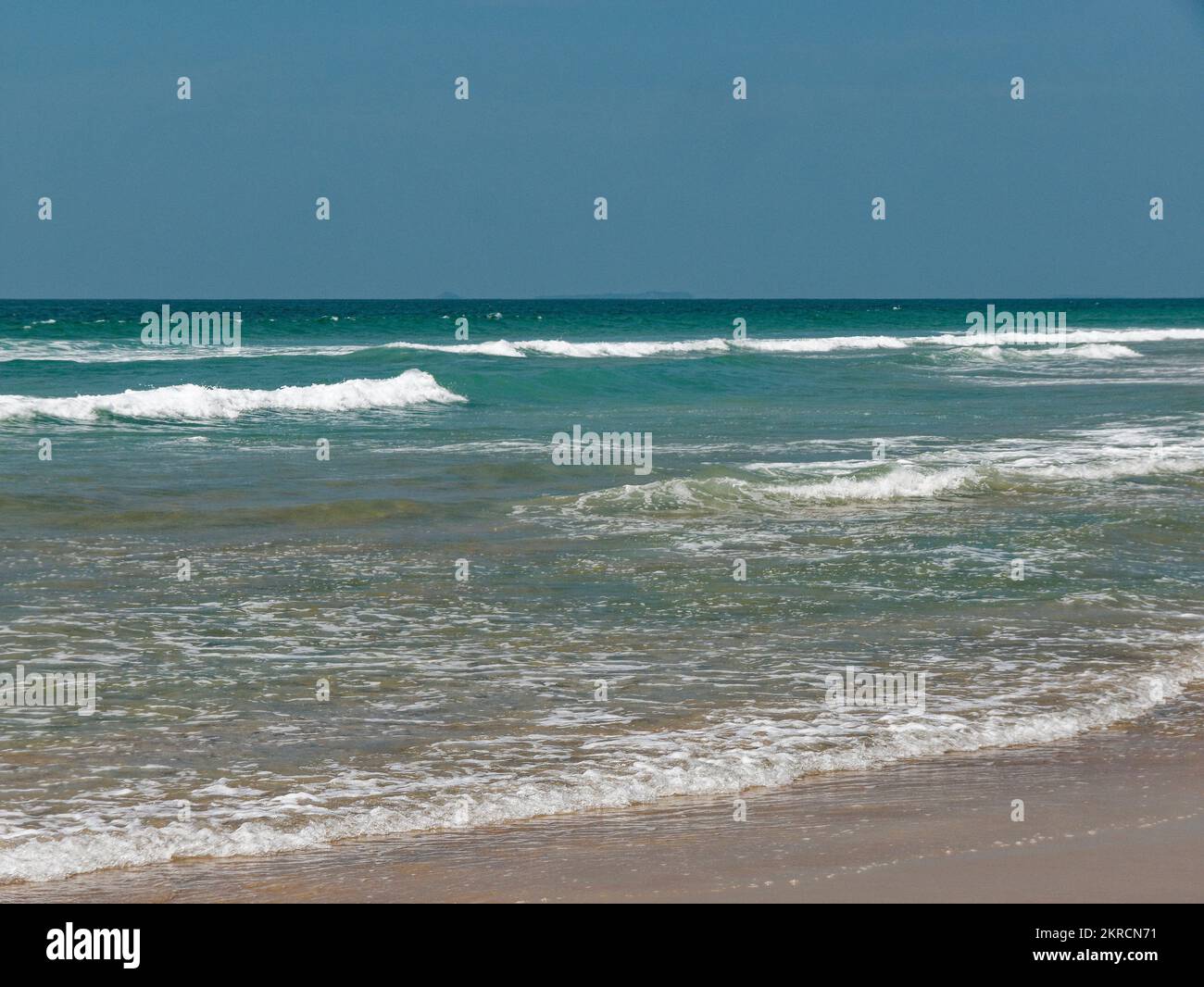 View of a tropical wave water seashore and sandy beach of Mobor in ...