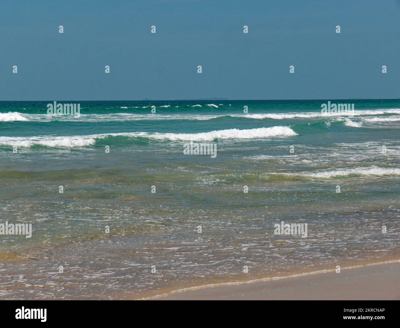View of a tropical wave water seashore and sandy beach of Mobor in ...