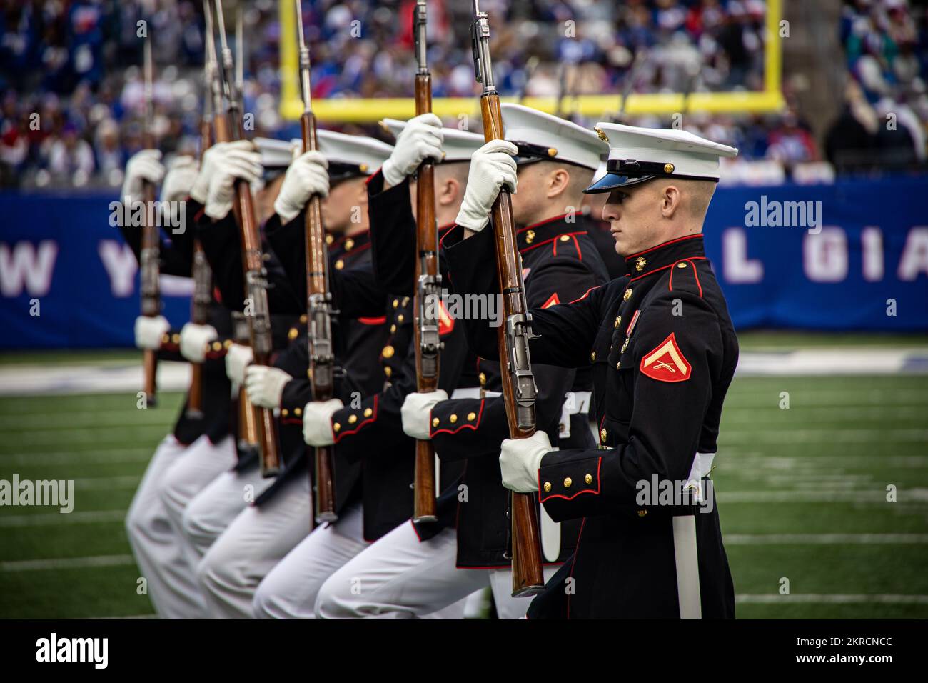 Marines with the Silent Drill Platoon perform during a halftime show ...
