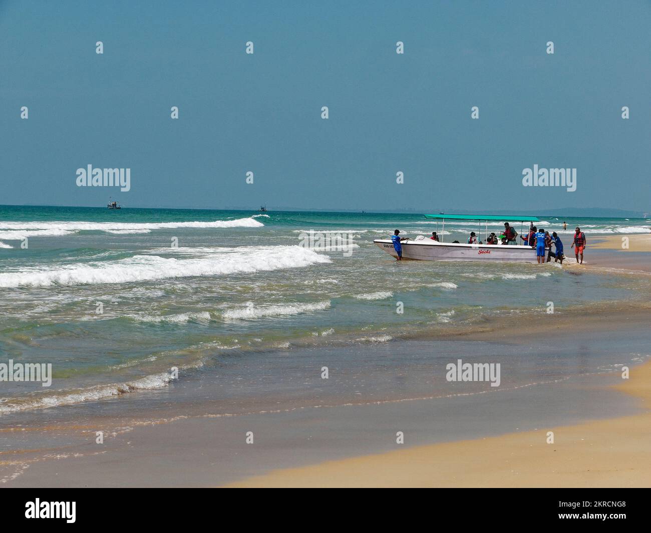 Sandy shore and tourist that love adventure in gorgeous sunny day at ...