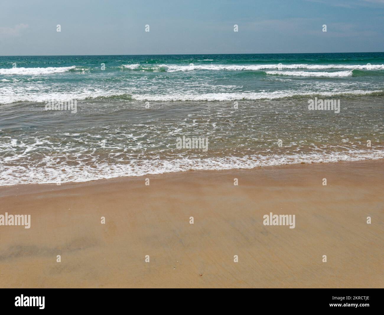 View of a tropical wave water seashore and sandy beach of Mobor in ...