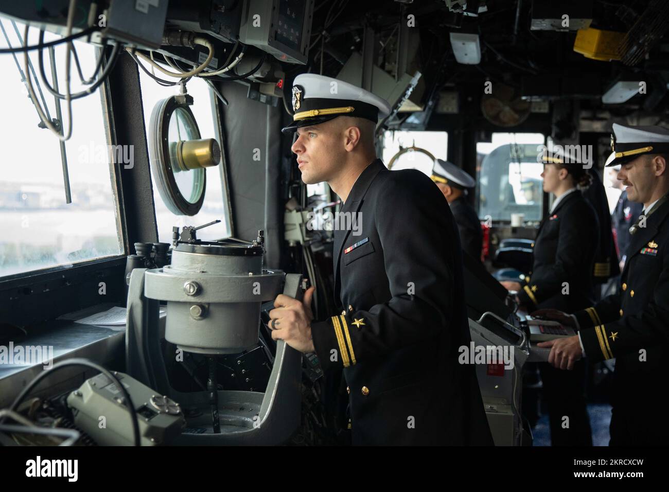 Ens. Seth Brock stands as conning officer on the Ticonderoga-class guided-missile cruiser USS ...