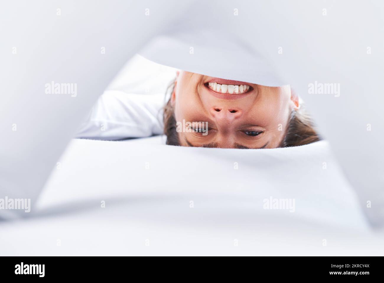 Nice female in bed relaxing or doing yoga Stock Photo - Alamy