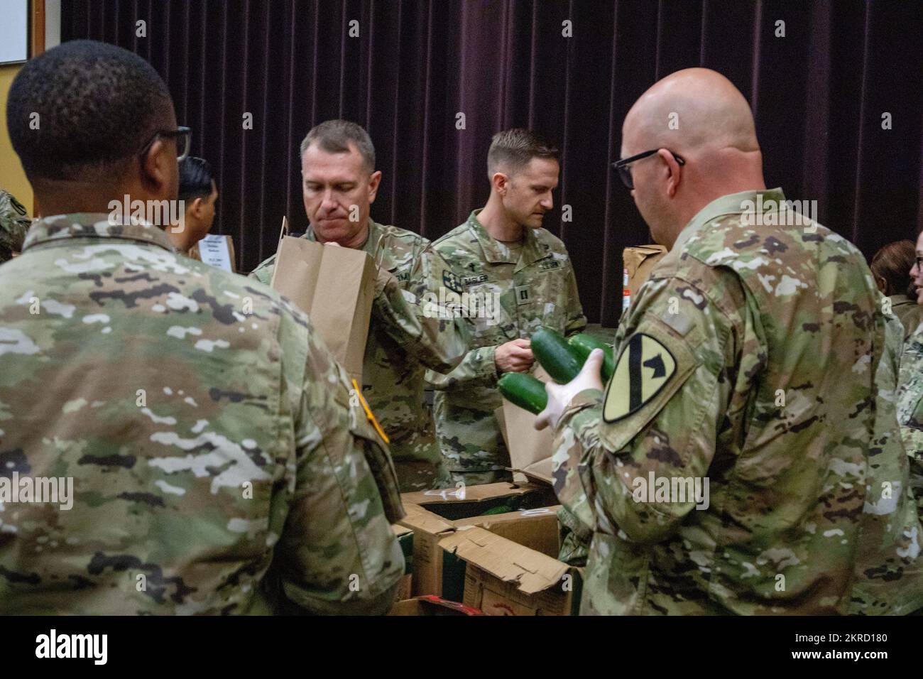 U.S. Army Soldiers work together to build holiday baskets and make them ...