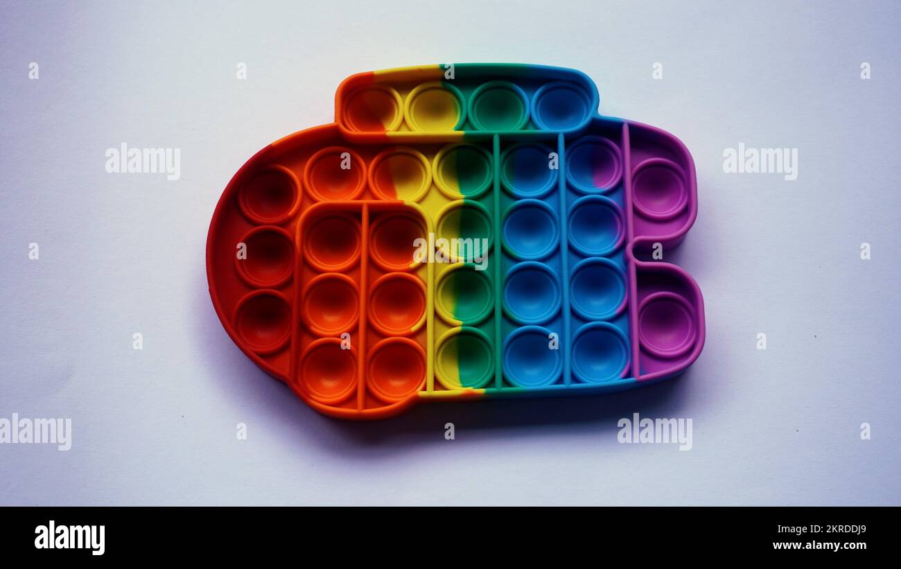 Close up colorful toy push it in white background for education Stock ...