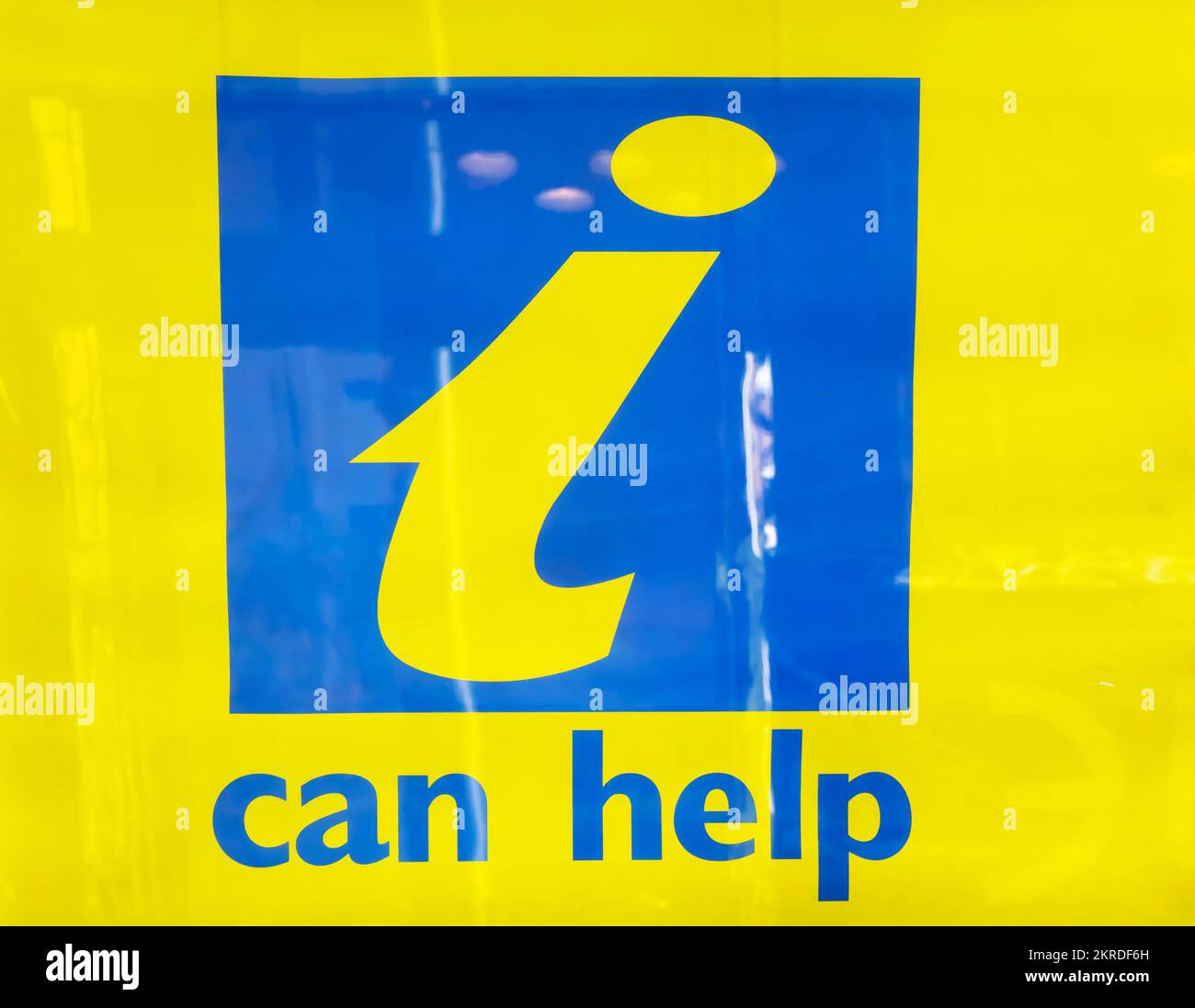 Tourist information sign in yellow and blue offering help to ...