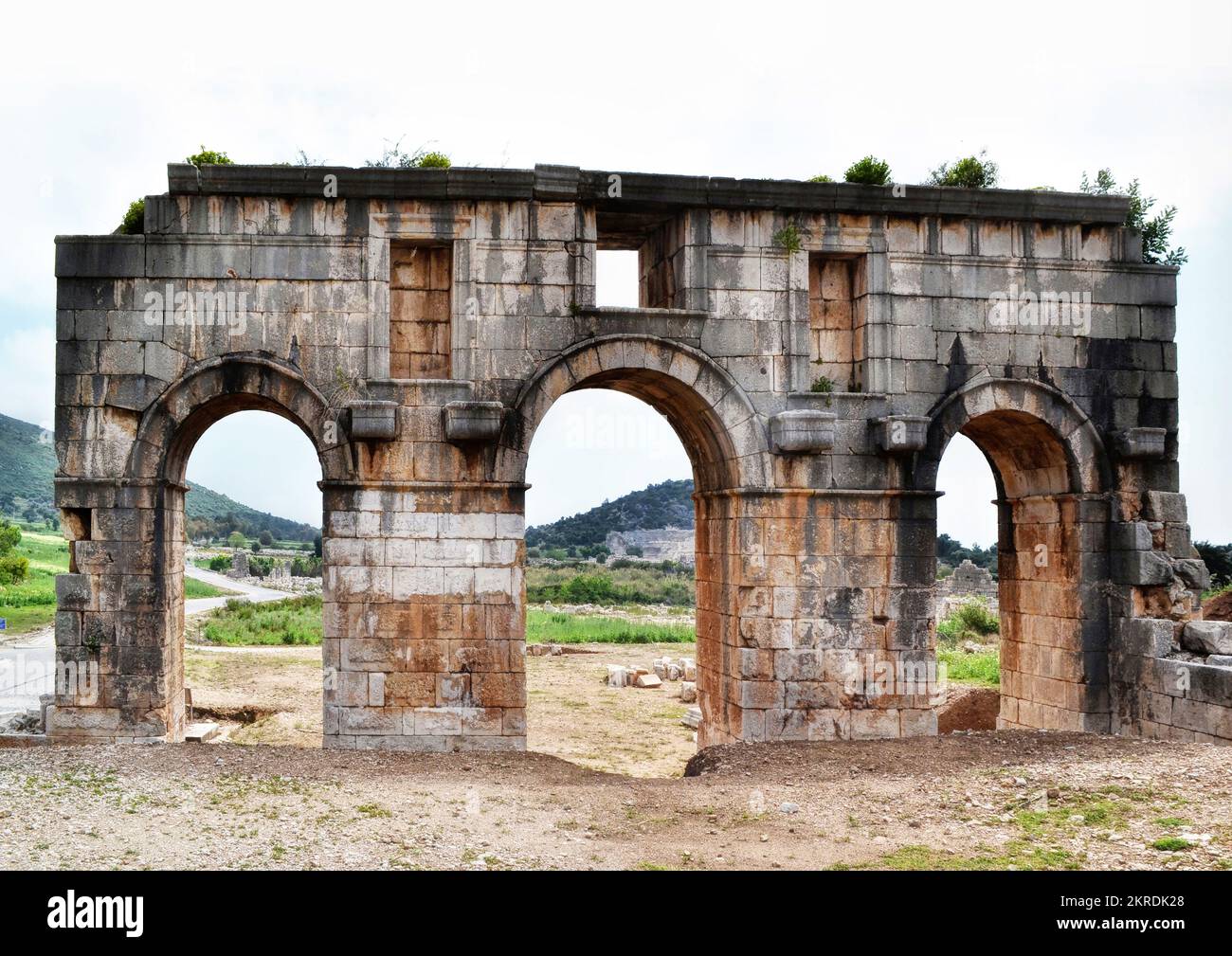 Antalya, Turkey - April 2014: Ruins and entrance gate of the ancient ...