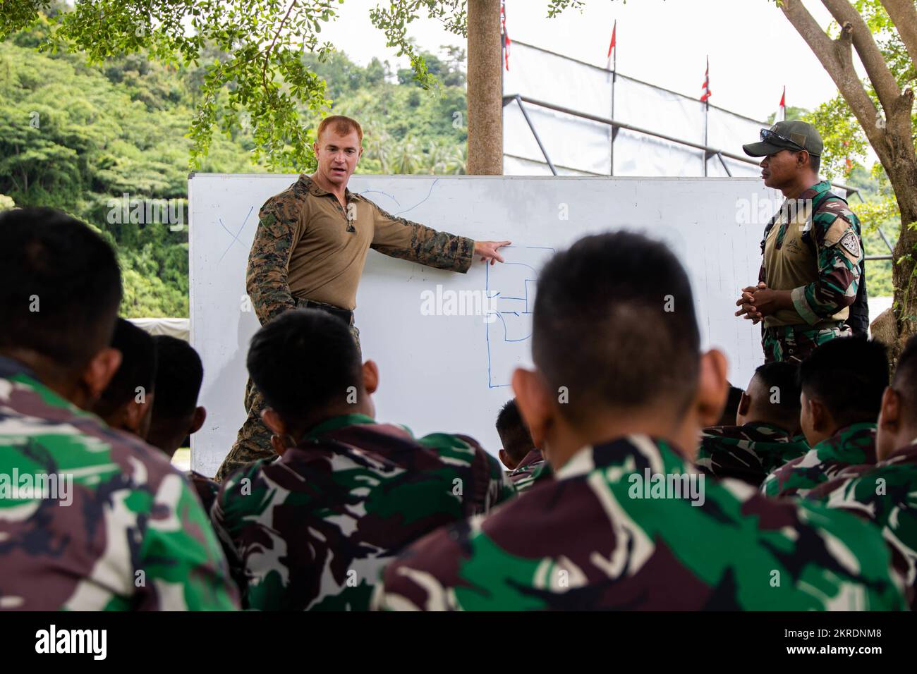 U.S. Marine Corps Gunnery Sgt. John Bumpus, left, a platoon sergeant with 1st Reconnaissance ...