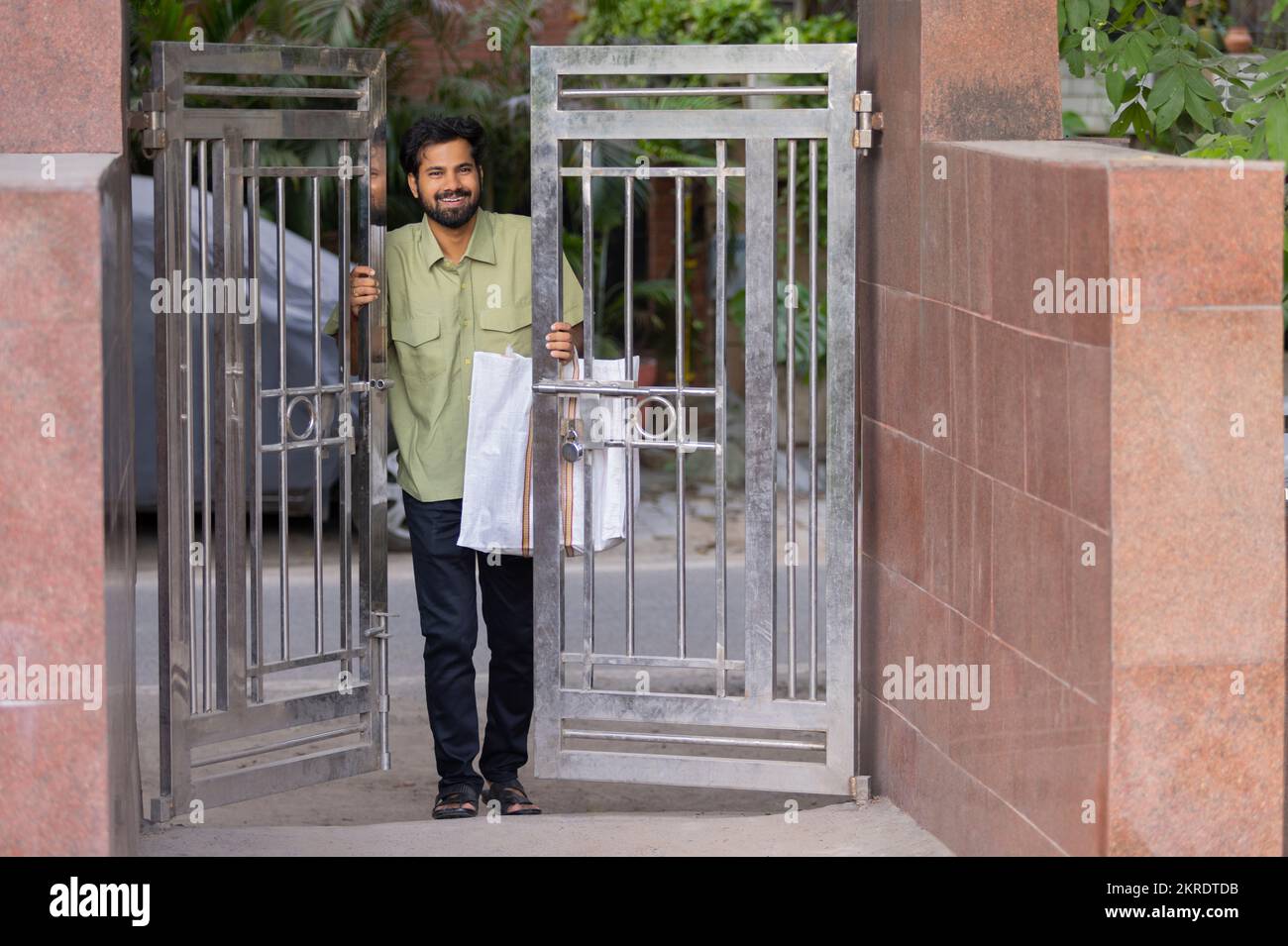 Man standing by gate hi-res stock photography and images - Alamy