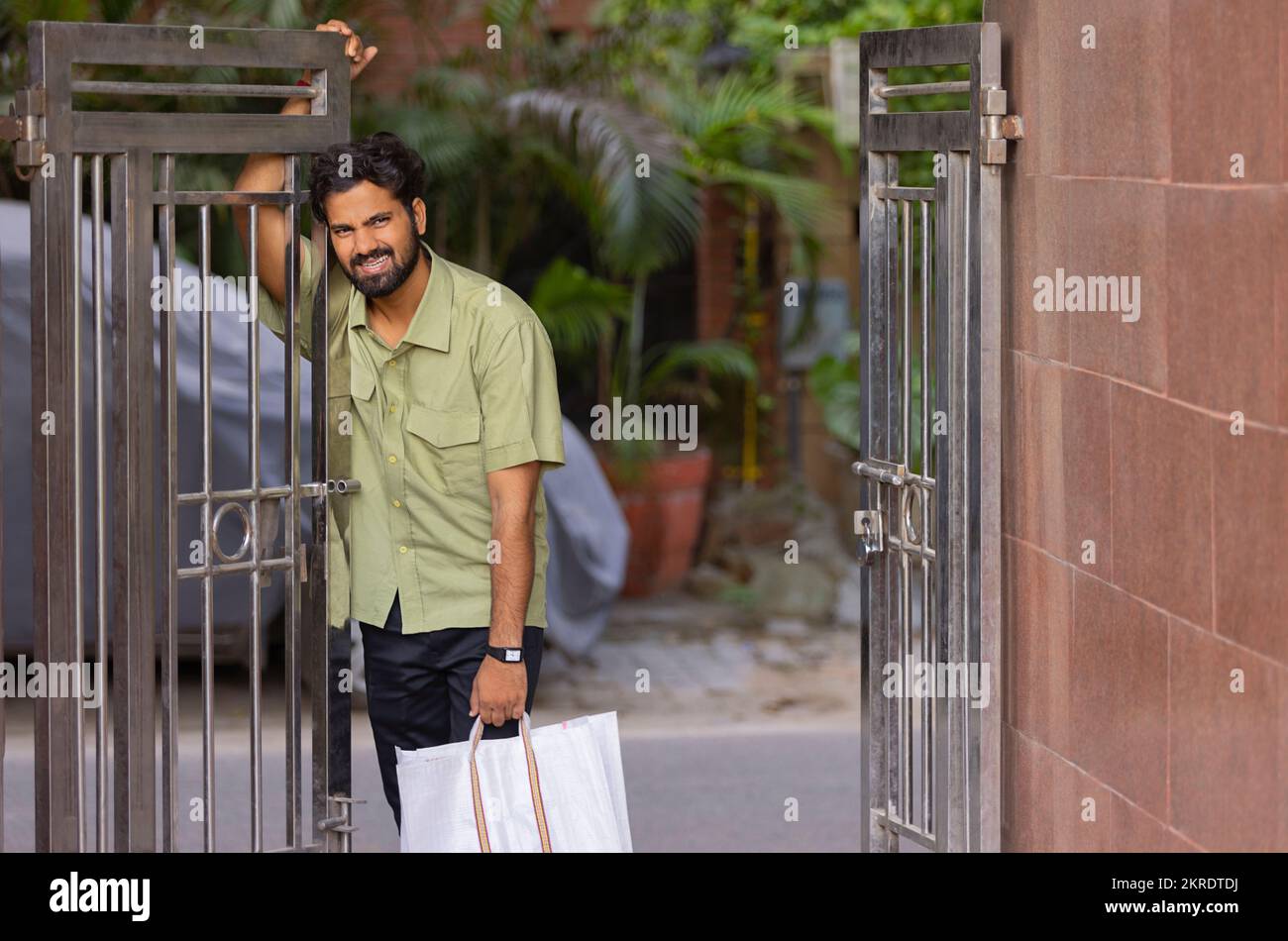 Man standing by gate hi-res stock photography and images - Alamy