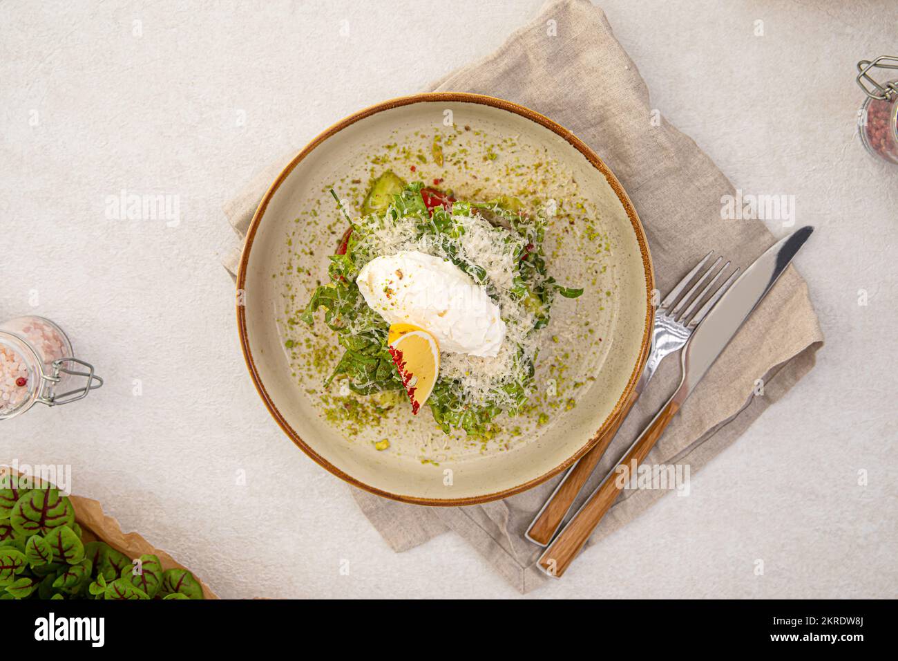 Portion of avocado salad with tomato and greens Stock Photo - Alamy