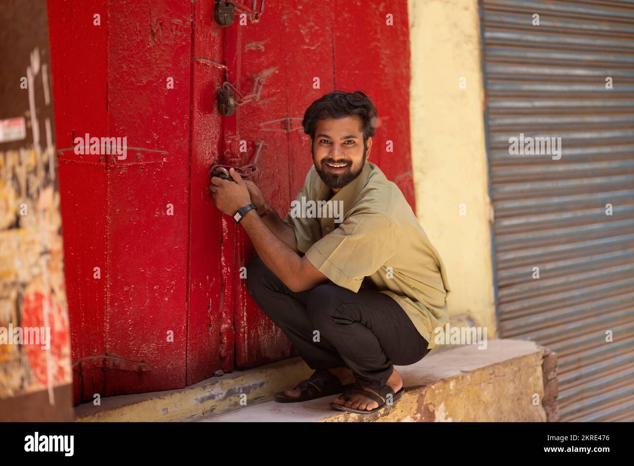 Man unlocking door hi-res stock photography and images - Alamy