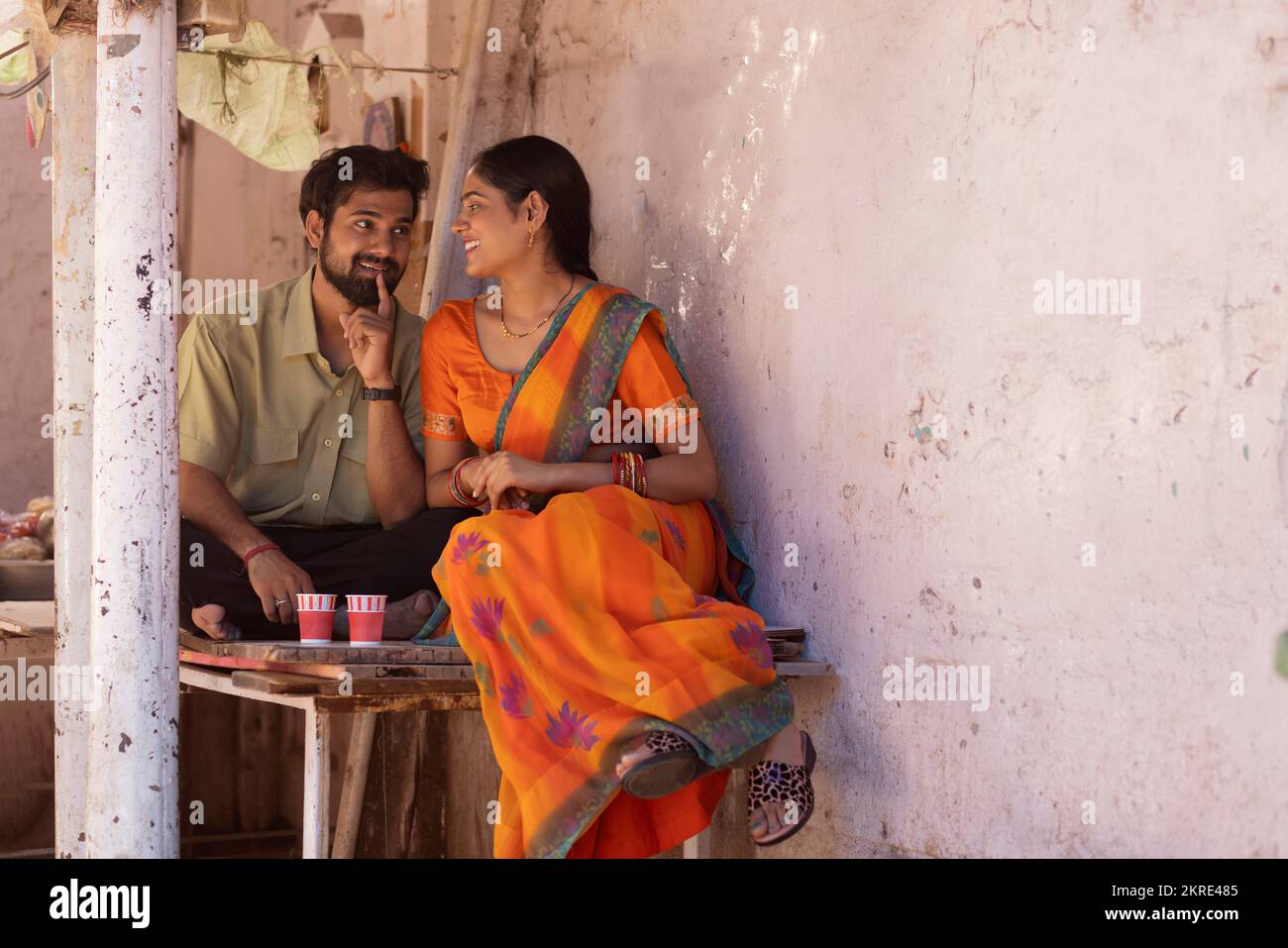 Couple sitting side by side at table hi-res stock photography and ...