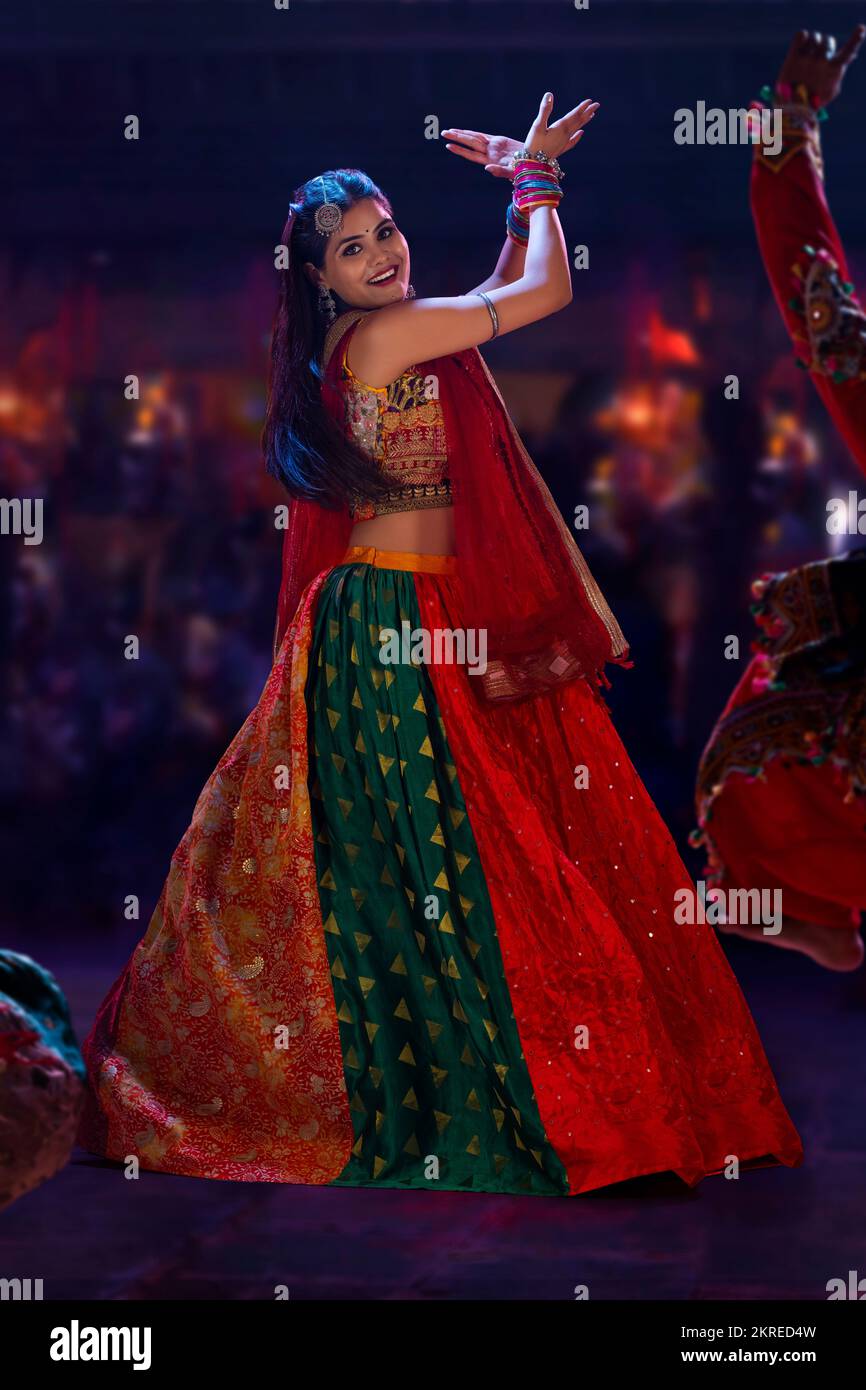 Gujrati woman performing Garba on stage Stock Photo - Alamy