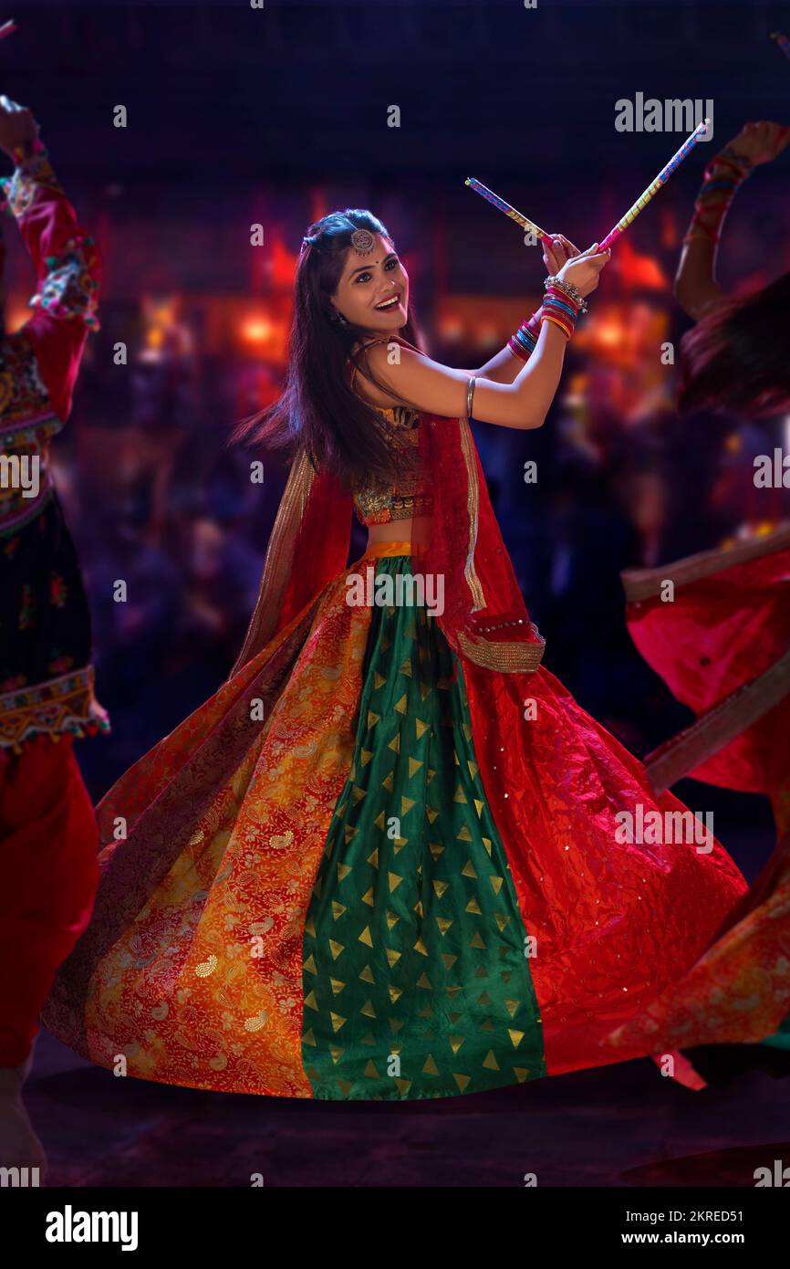 Gujrati woman performing Garba on stage Stock Photo - Alamy