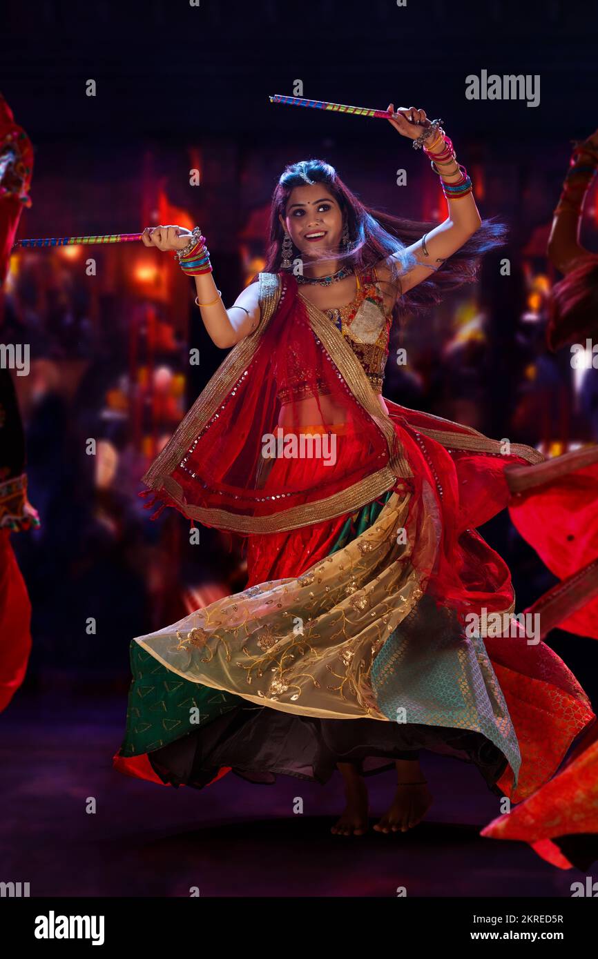 Gujrati woman performing Garba on stage Stock Photo - Alamy