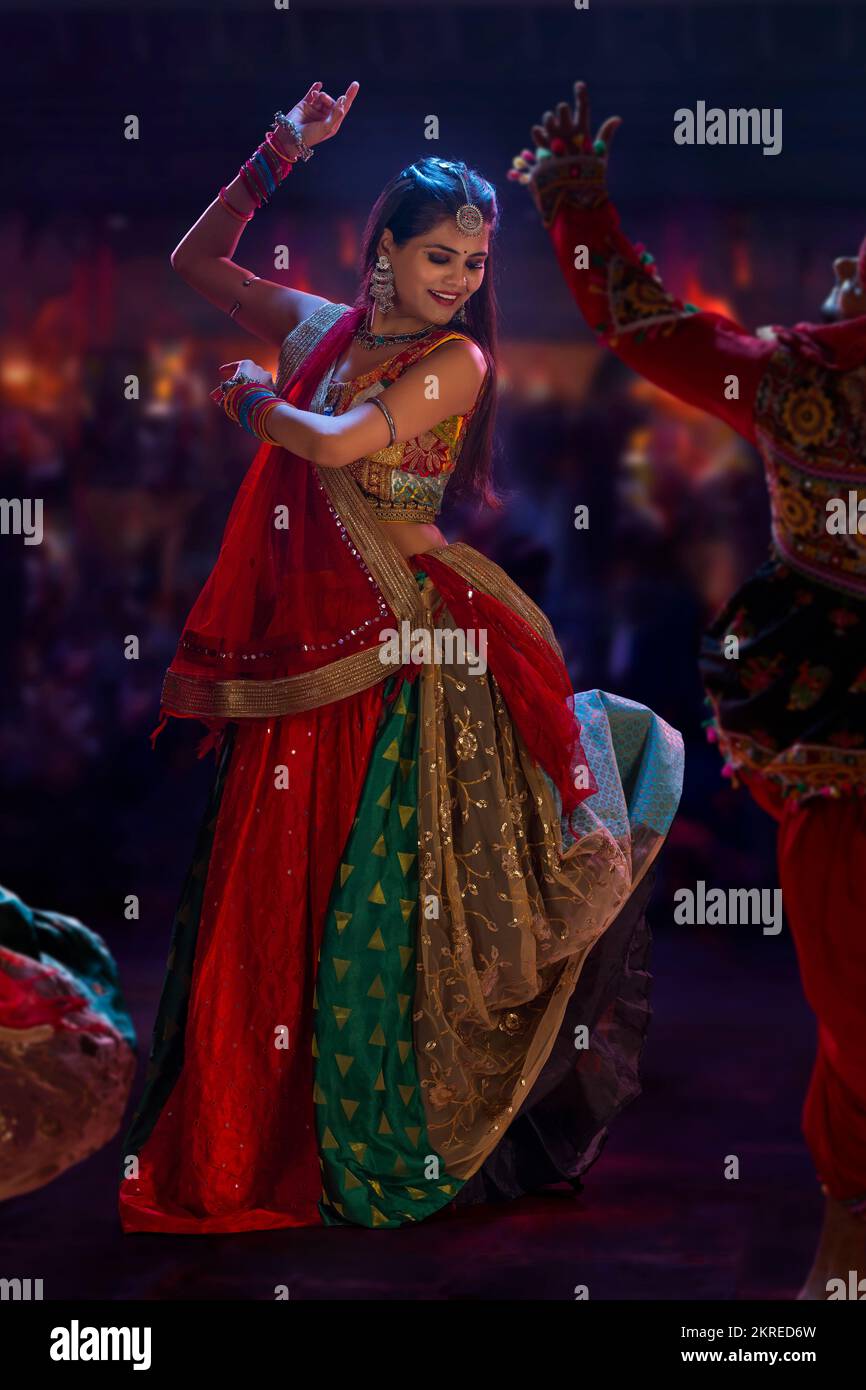 Gujrati woman performing Garba on stage Stock Photo - Alamy