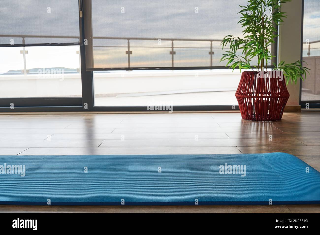 Cozy room for fitness close to the sea with exercise mat. Empty place ...