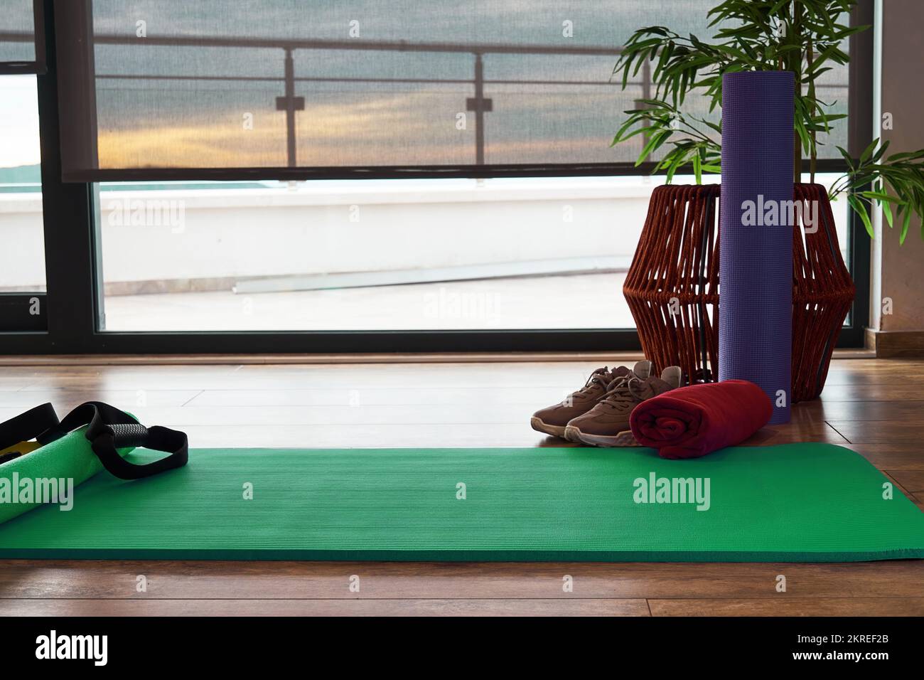 Empty aerobic center with exercise mat and equipment for stretching ...