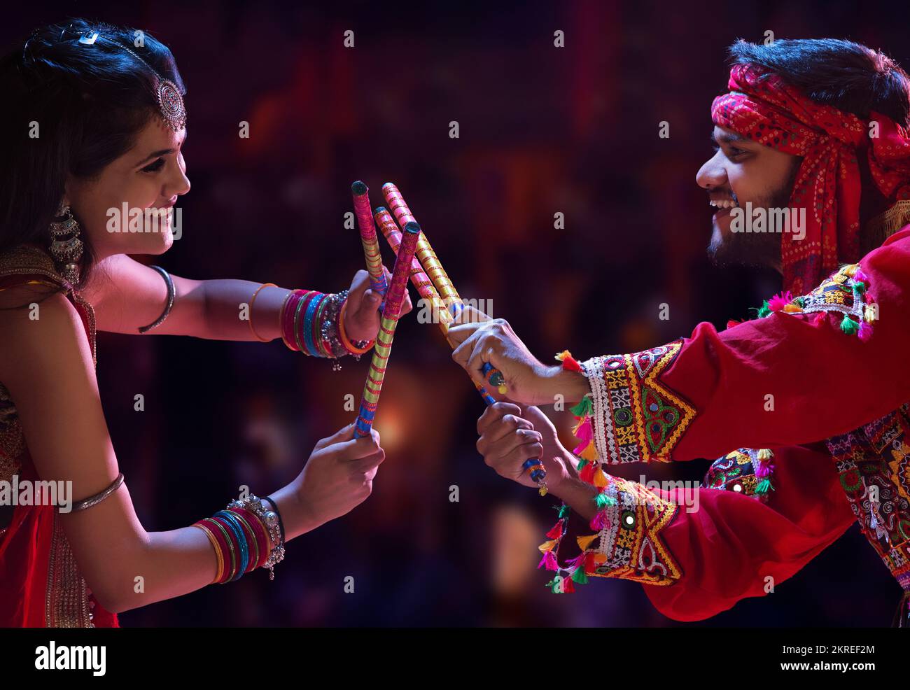 Gujrati couple performing Garba on stage Stock Photo - Alamy