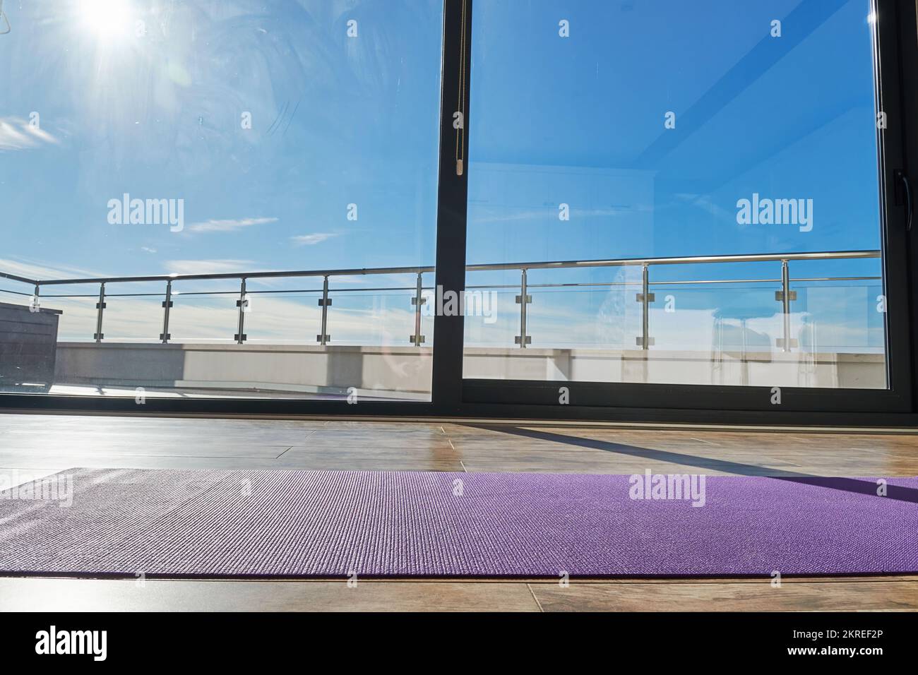 Empty fitness center room high up in the sky with wide windows. Cozy ...