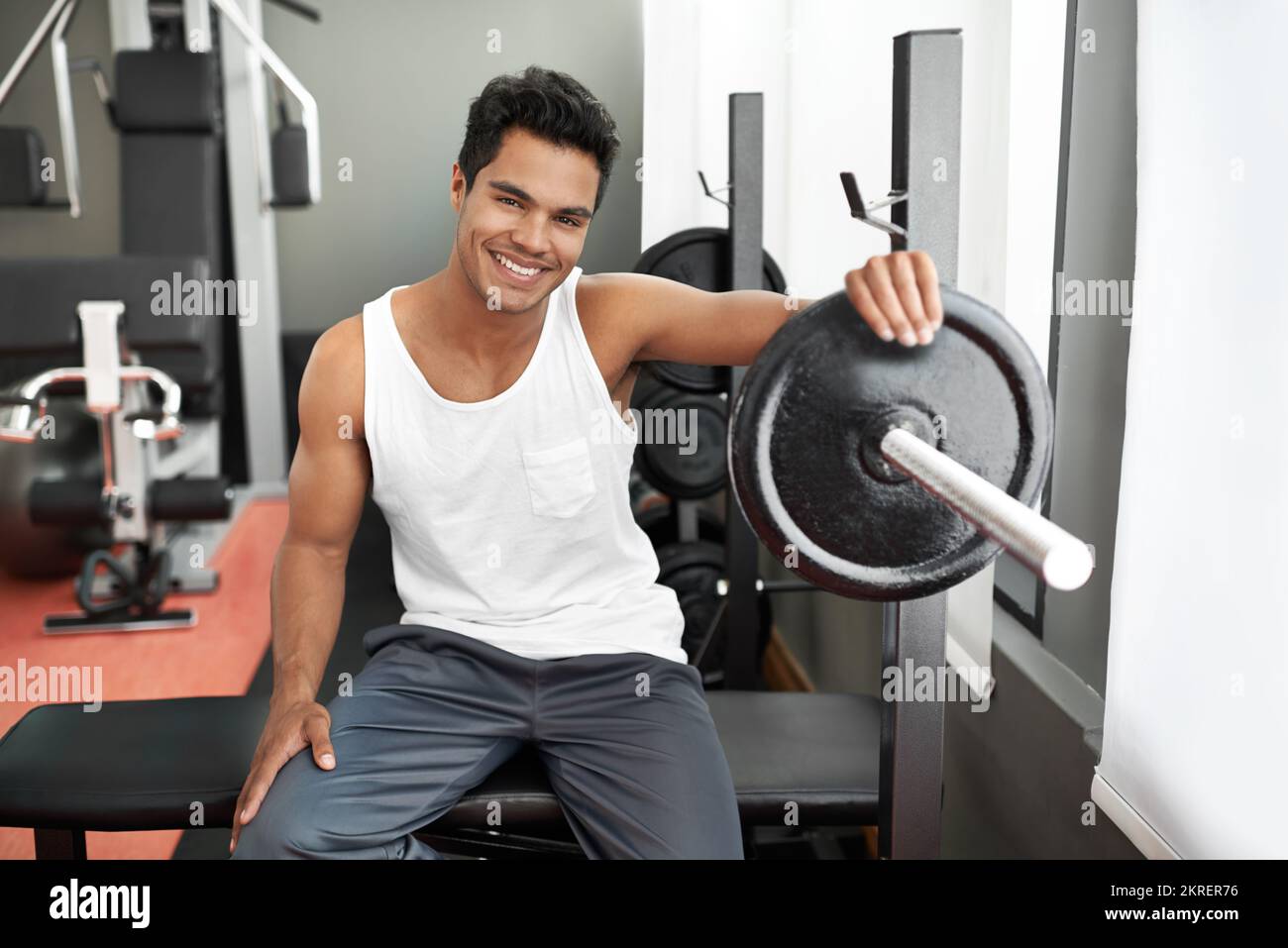 Feeling positive about my workout. A young ethnic man smiling while ...