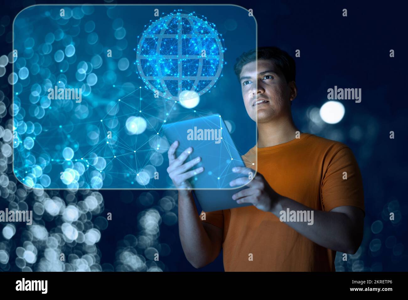 Young man uses digital tablet on virtual visual screen at night Stock ...