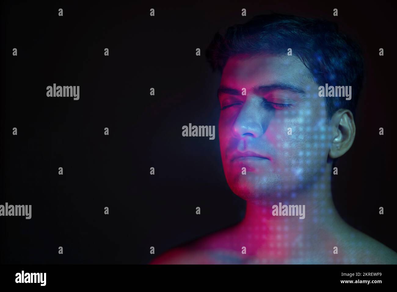 Close-Up Portrait Of Young man With Closed Eyes and neon light falling ...