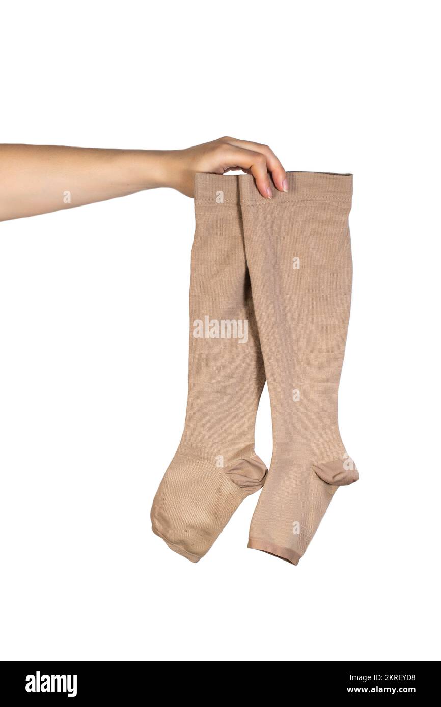 Compression stockings for legs with varicose veins on the legs are held ...