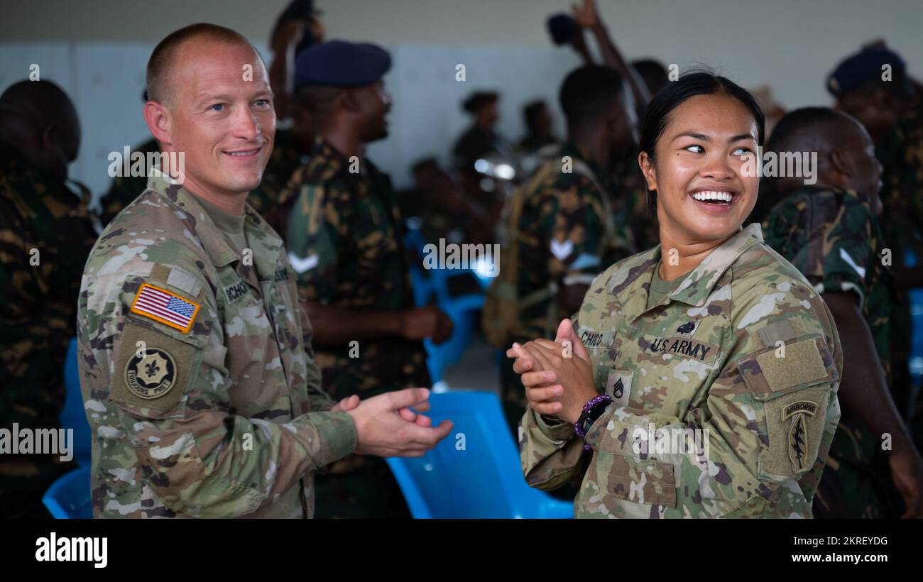 U.S. Army Sgt. 1st Class, Andrew Kirchoff, left, a civil affairs team ...
