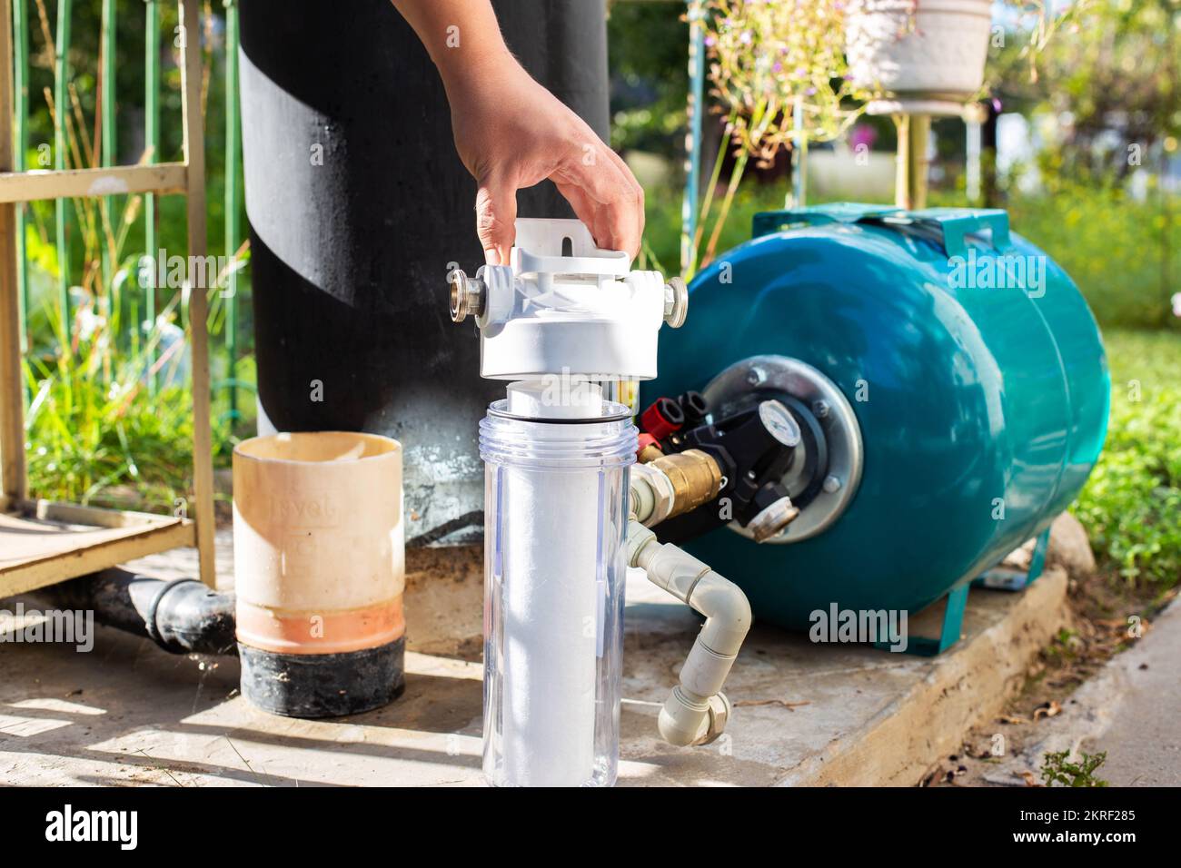 Water supply system from a well in a country house. New water filter ...