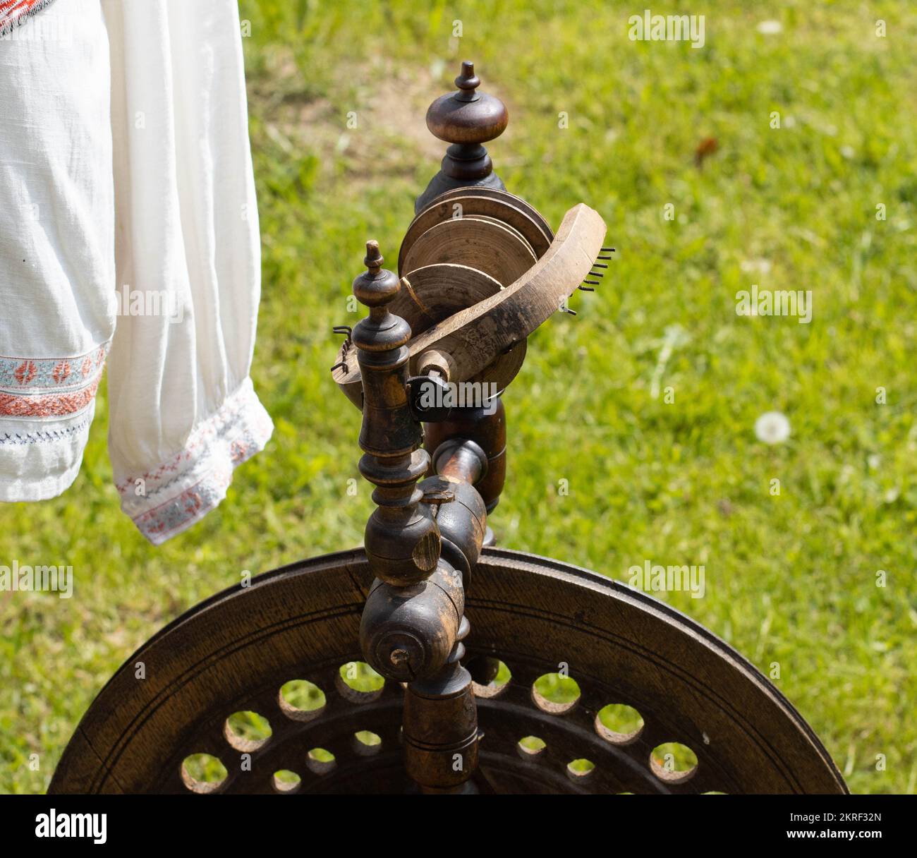 Antique vintage spinning wheel, wooden tool in the form of a wheel ...