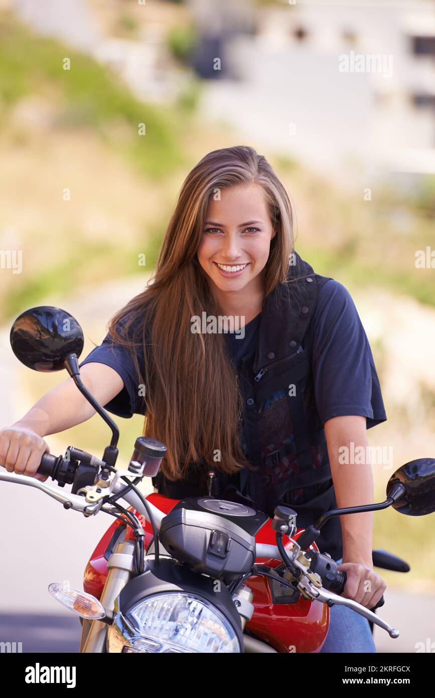 All she needs is speed. A beautiful young woman sitting on her ...