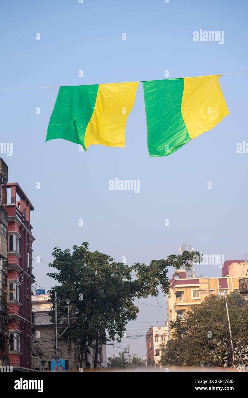 Brazilian flag is flaying on city street Stock Photo - Alamy