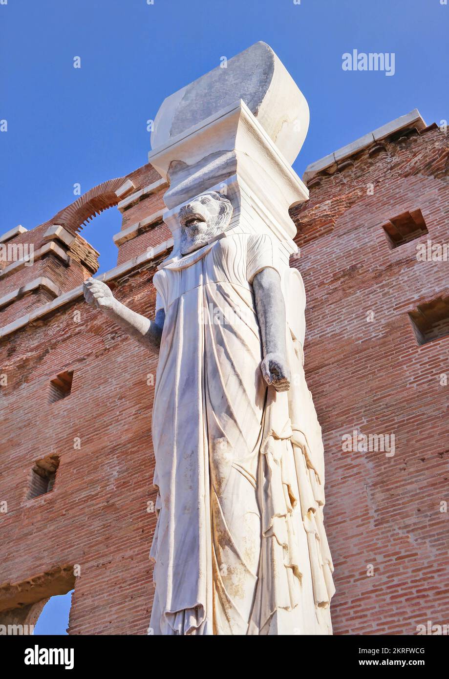 Bergama, Turkey, Sep. 2018: Red basilica of Bergama and statue of the ...