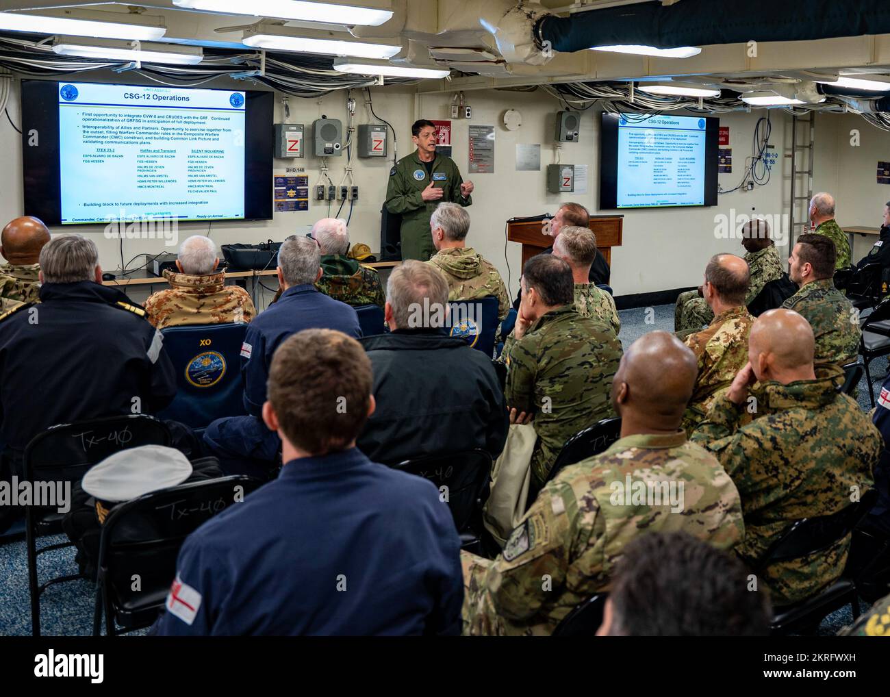 Rear Adm. Greg Huffman, commander, Carrier Strike Group (CSG) 12 briefs ...