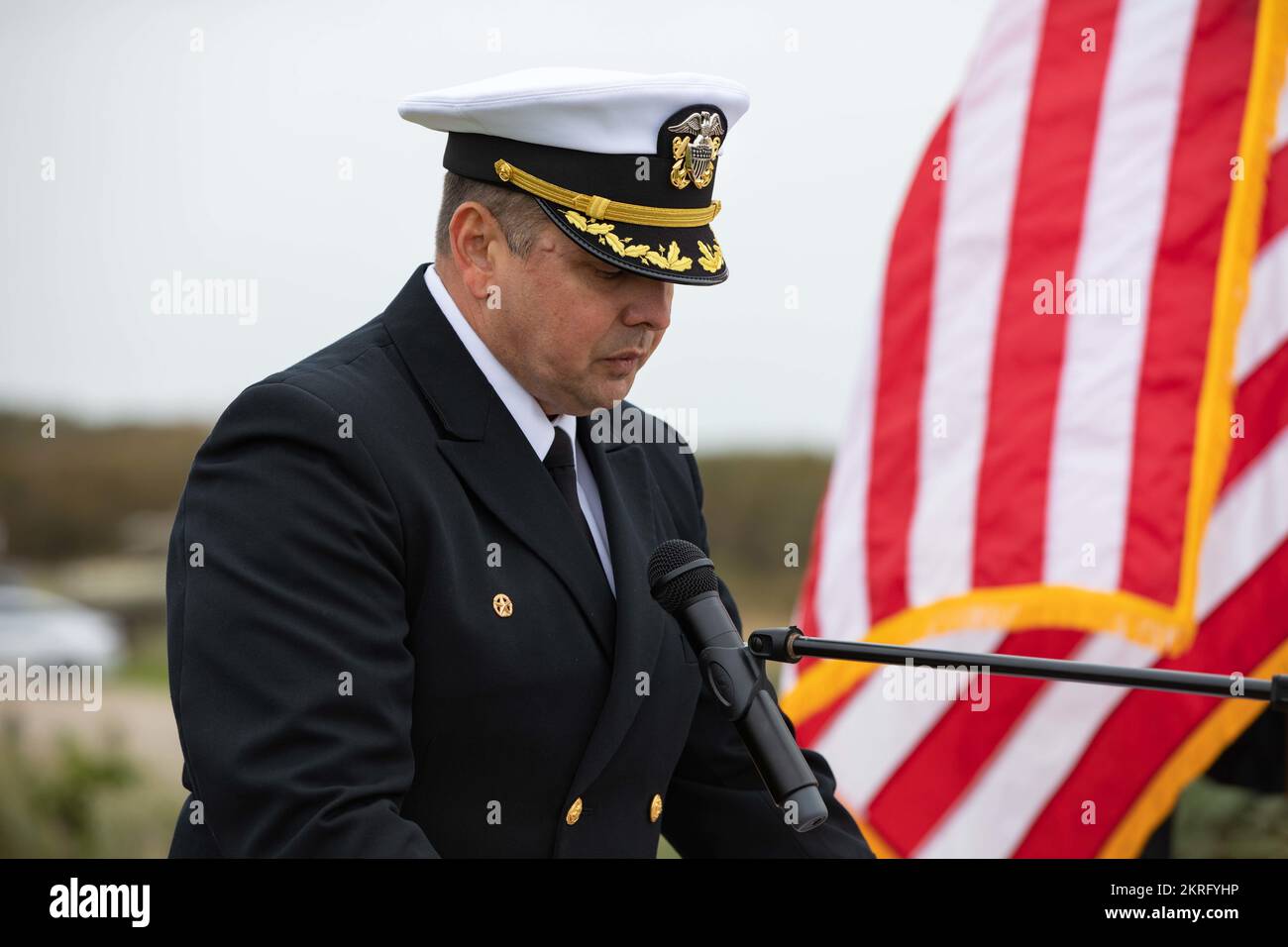 Capt. Gary M. Chase, commanding officer, USS Normandy, gives an address ...