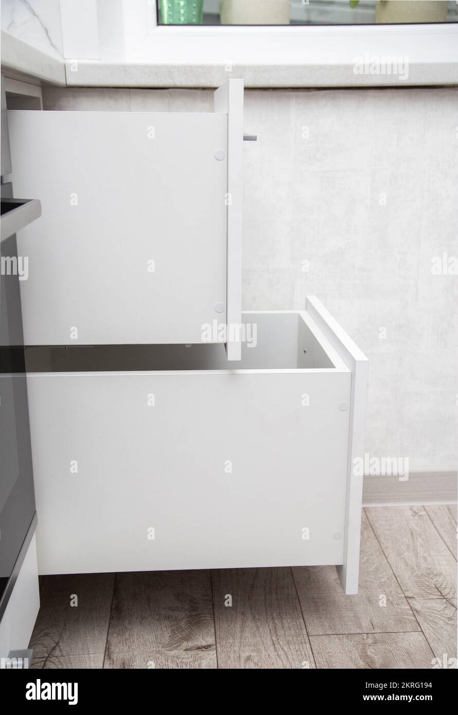 Modern sliding drawer system in the kitchen. Production of kitchen ...