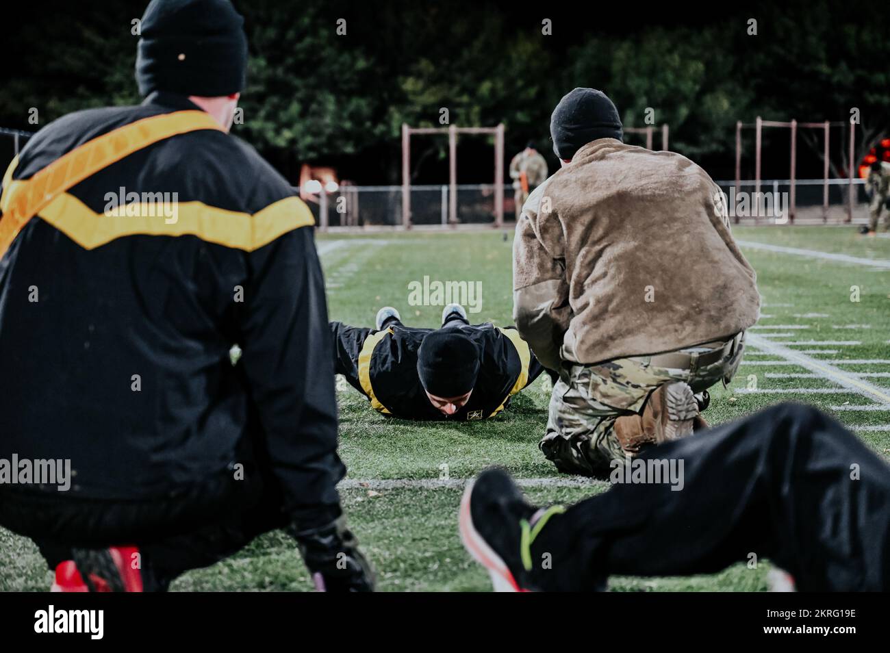 A student at USAICoE's NCO Academy does hand release push-ups while ...