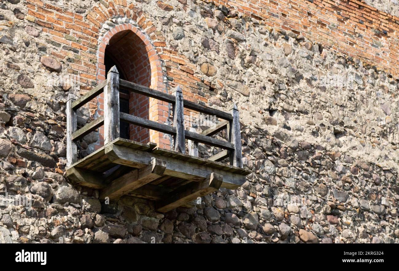 Balcony in the stone wall of an ancient castle. 14th century building ...